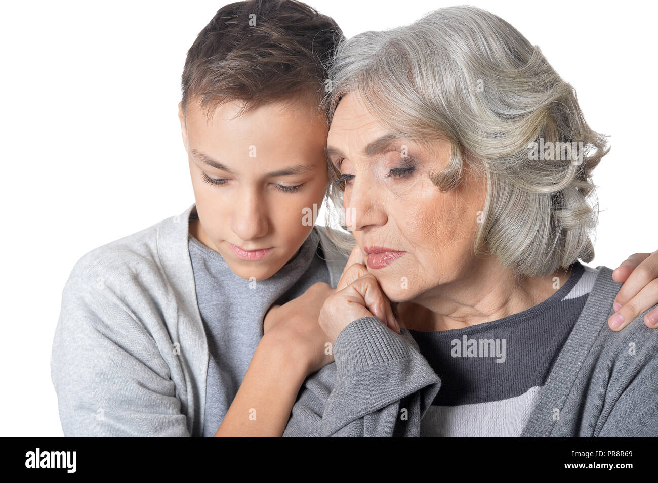Portrait of sad grandmother and grandson hug Stock Photo - Alamy