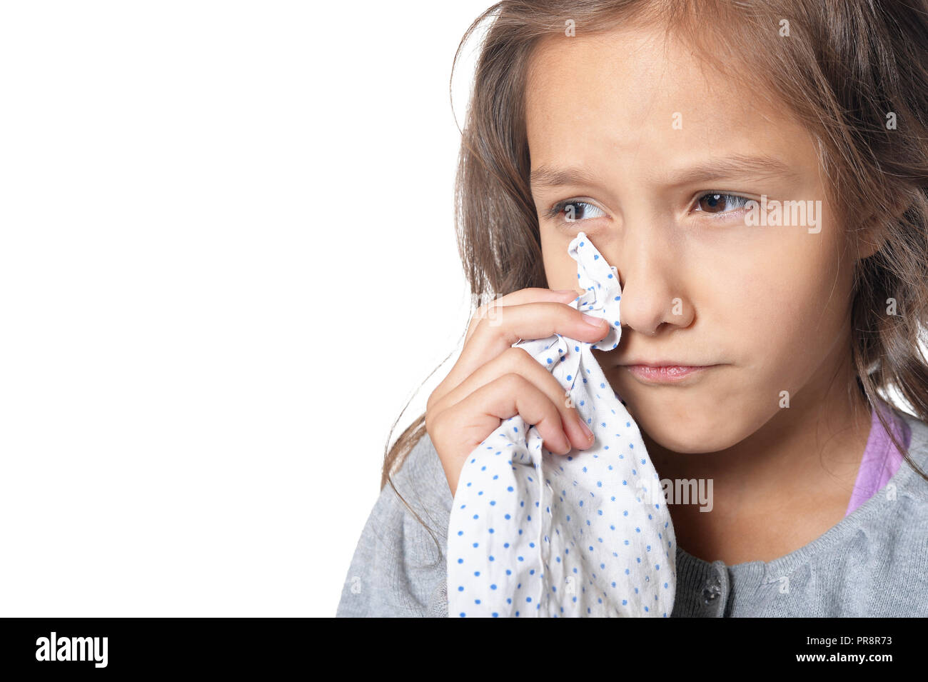 Portrait of sad little girl crying on white background Stock Photo - Alamy