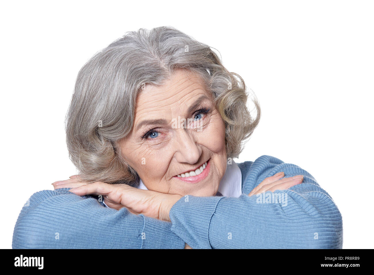 Happy smiling senior woman posing on white background Stock Photo - Alamy