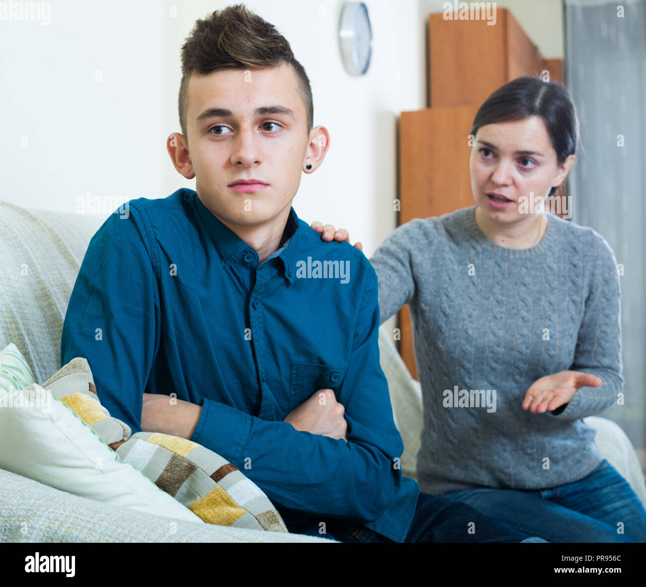 Home portrait of soft character woman and offended teen Stock Photo - Alamy