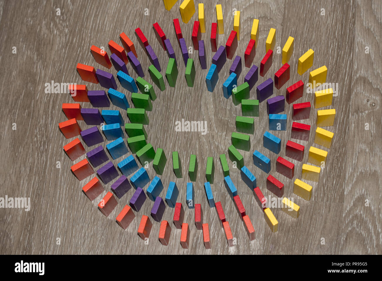 Colorful Domino Blocks in a line on a white background Stock Photo - Alamy