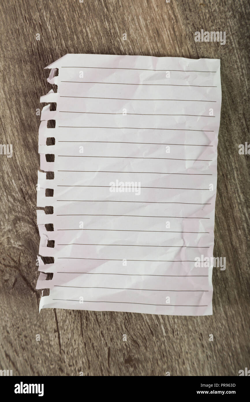 Crumpled sheet notebook line on table Stock Photo - Alamy