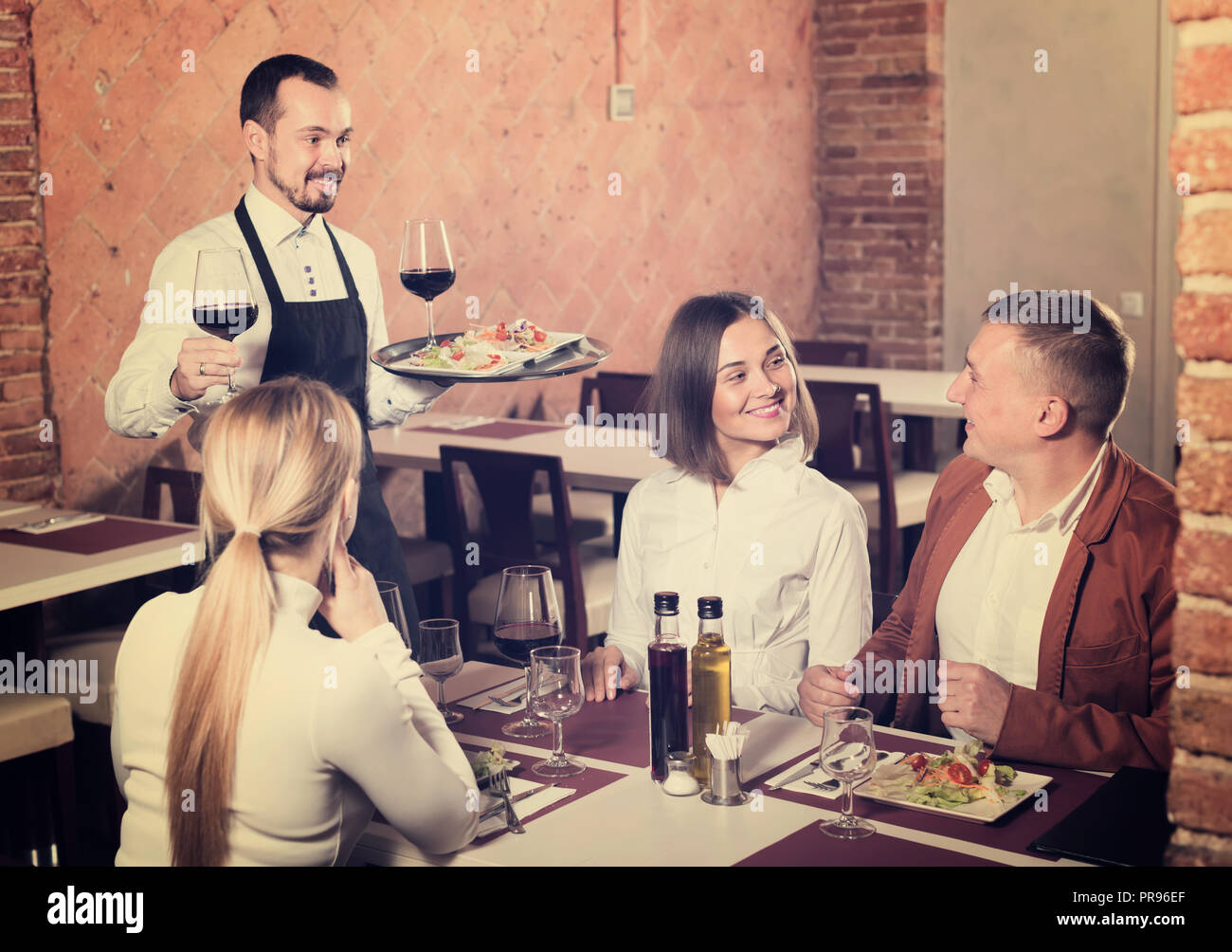 Young waiter placing order hi-res stock photography and images - Alamy