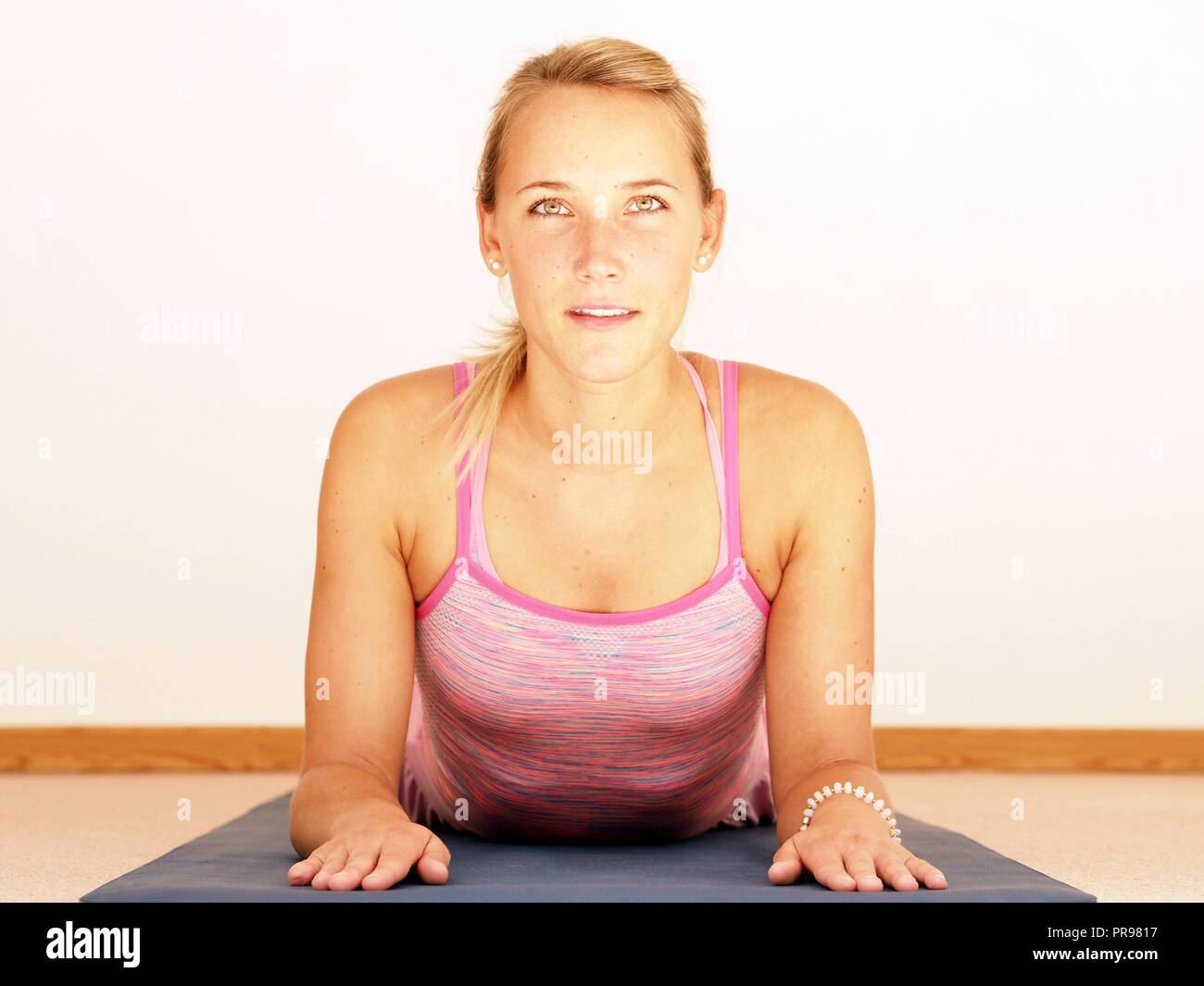 Young attractive woman in different yoga poses, relaxing and enjoying ...