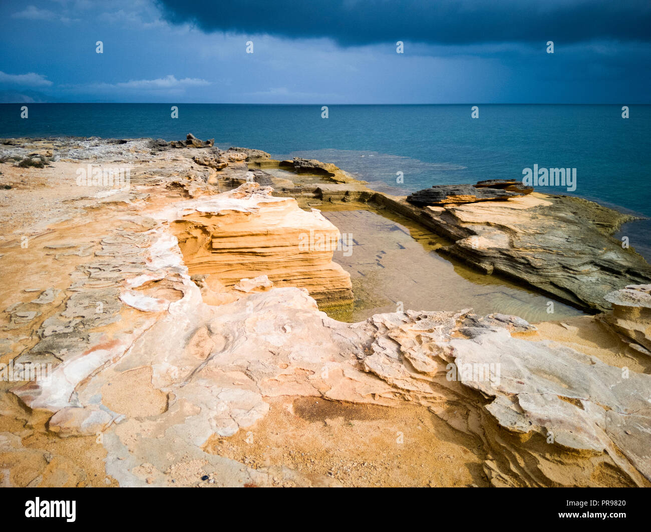 Rocky coast of Mallorca, Spain with limestone rocks of various shapes ...