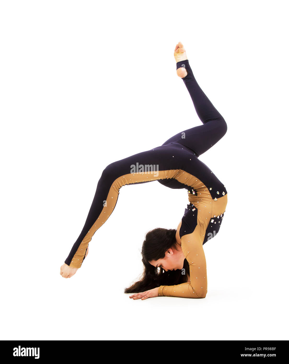 Acrobat does gymnastics, isolated image on a white background. A young ...