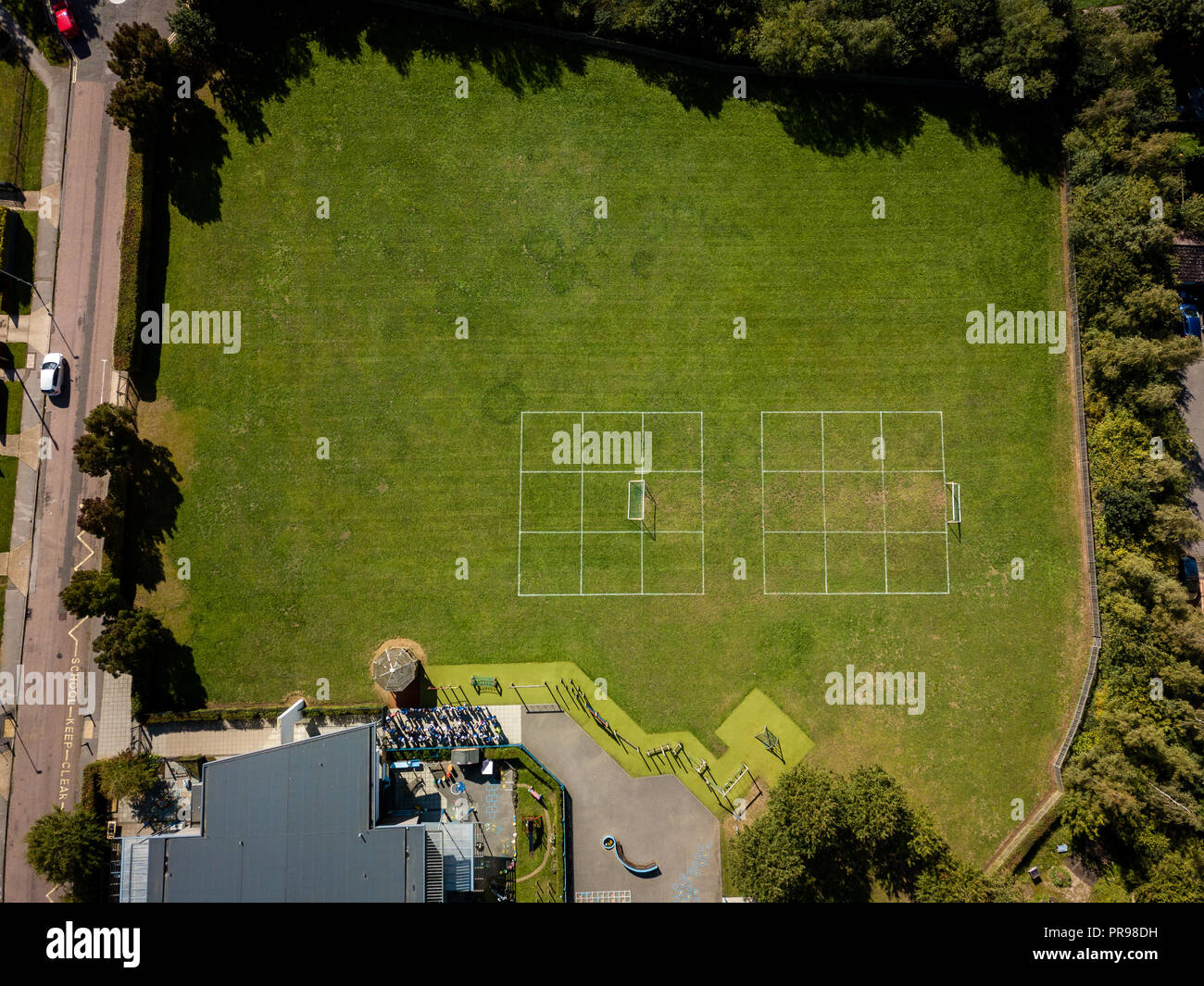 Aerial view of sports venue with big nice grass field and football ...