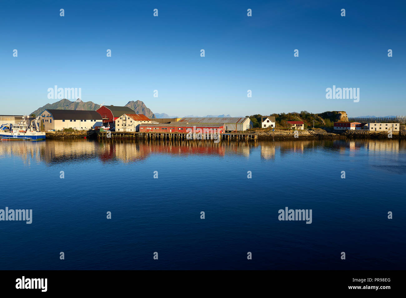 Old Norwegian Fishing Warehouses On The Waterfront At Kjeøya To The ...