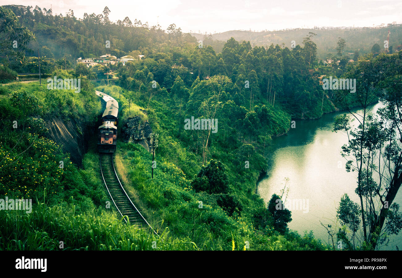 Train over Ihala Kotmale reservoir at Thalawakele in Sri Lanka Stock ...