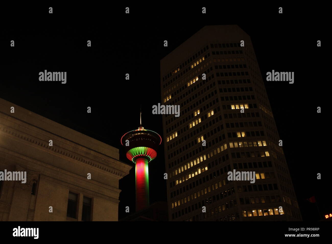 Calgary Tower lit up at night Stock Photo - Alamy