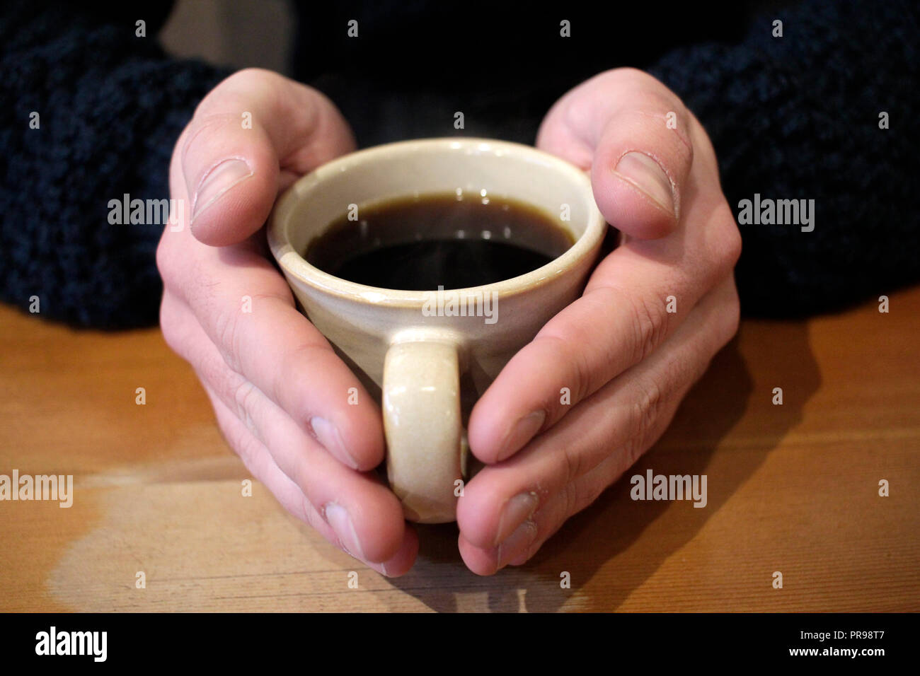 Hold cup both hands hi-res stock photography and images - Alamy
