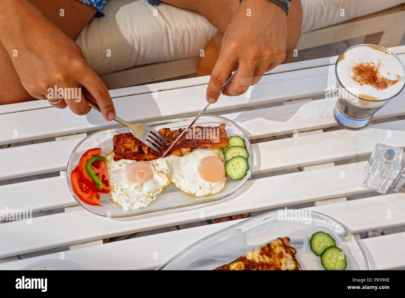 Men's hands and Breakfast on the table background Stock Photo - Alamy