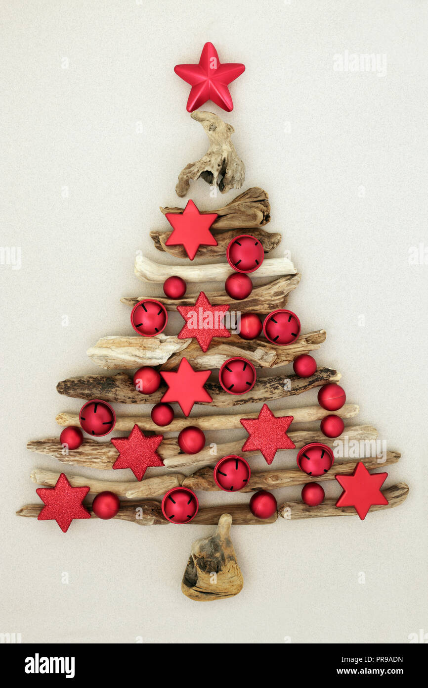Abstract driftwood Christmas tree with red bauble star and bell ...
