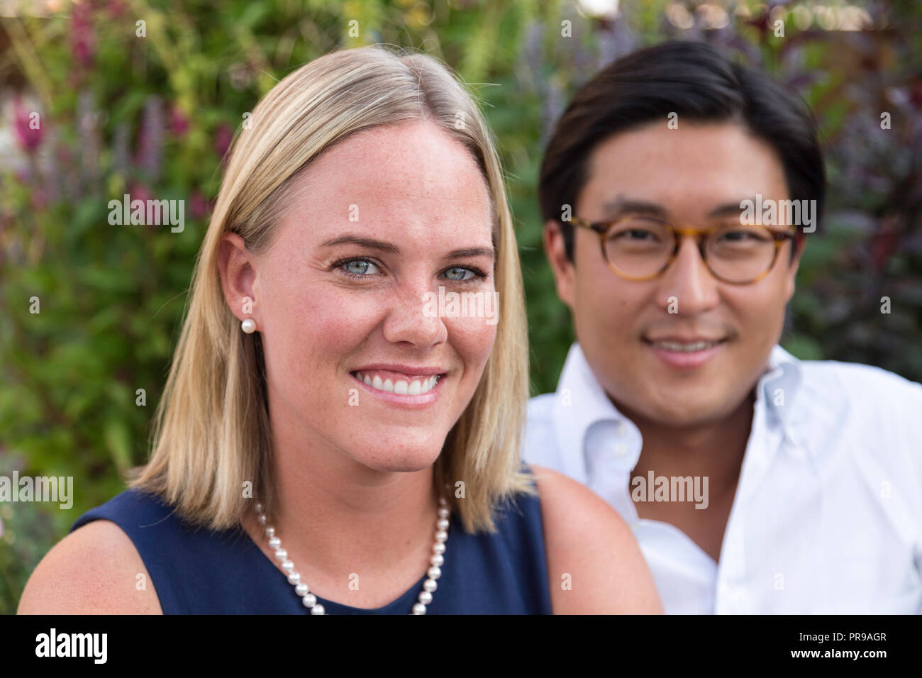 Attractive Mixed Race Couple Pose in Garden, USA Stock Photo - Alamy