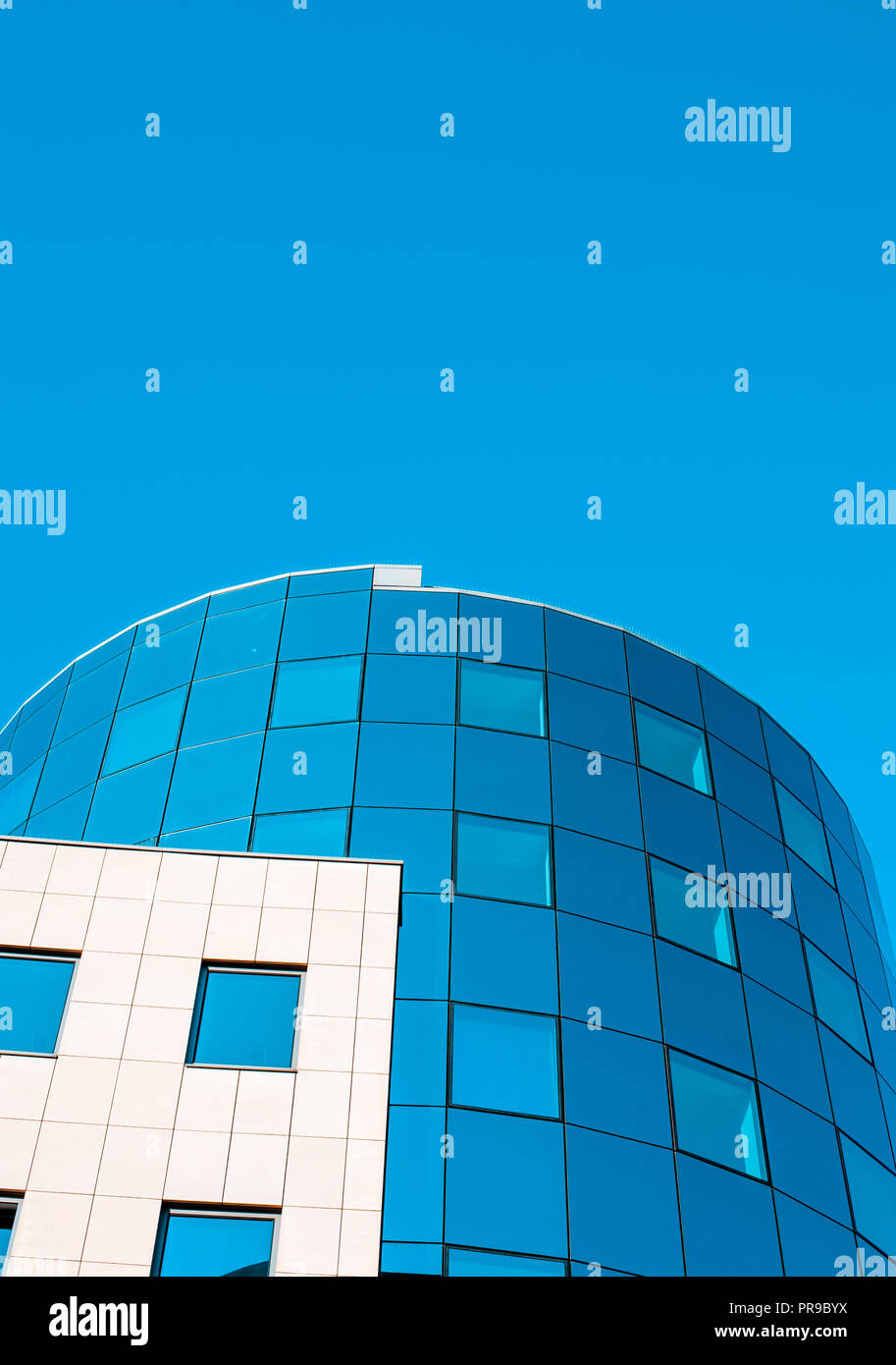 Modern architecture building with blue exterior and the blue sky ...