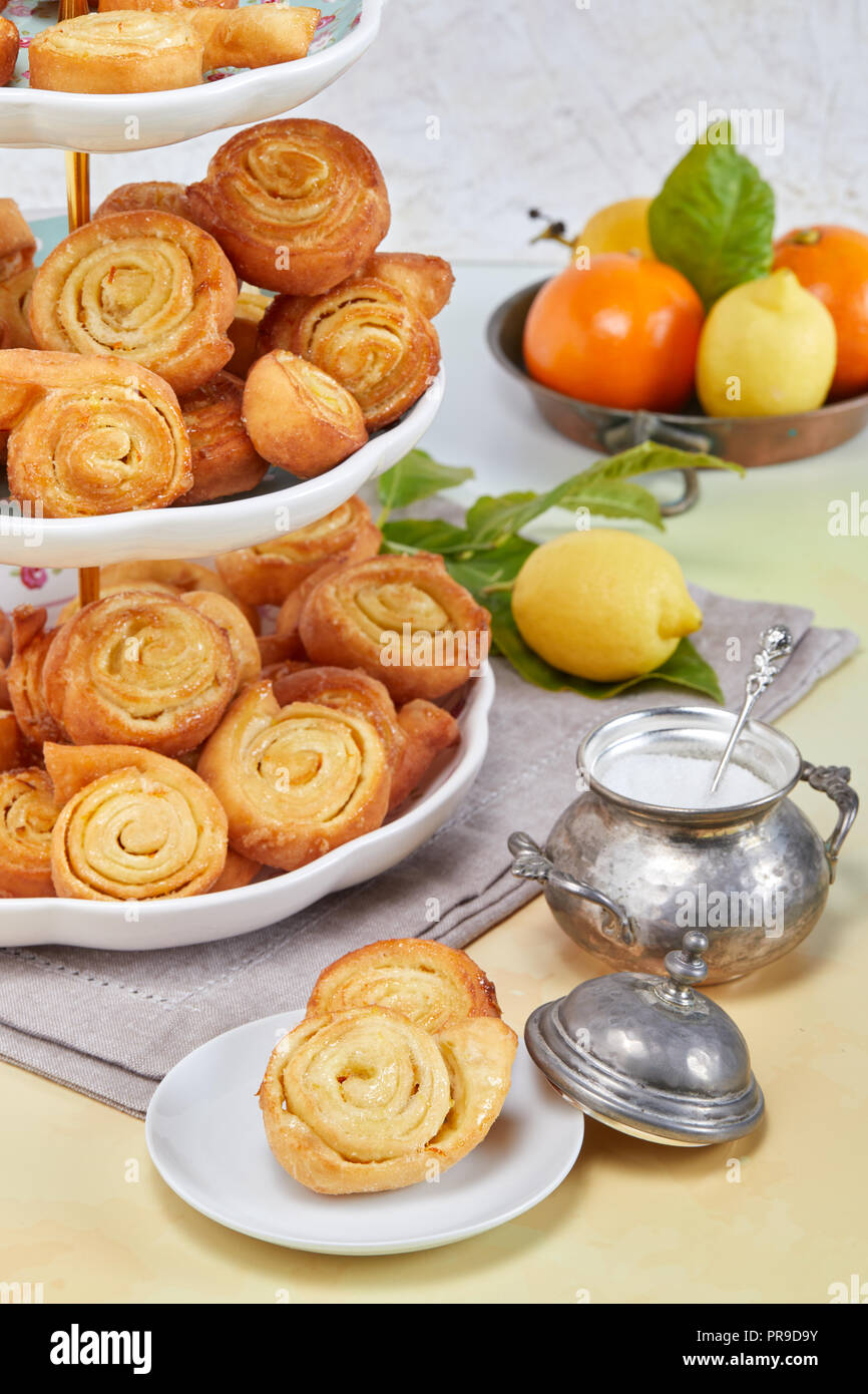 Closeup of Italian pinwheel orange pastries, typical sweets made during ...