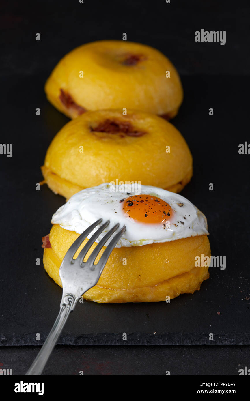 Bulz, a traditional Romanian meal composed of polenta balls stuffed ...