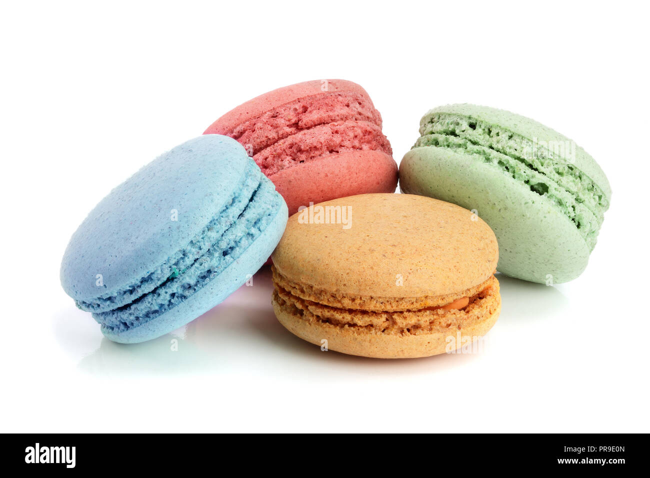 four macaroons isolated on white background closeup Stock Photo - Alamy