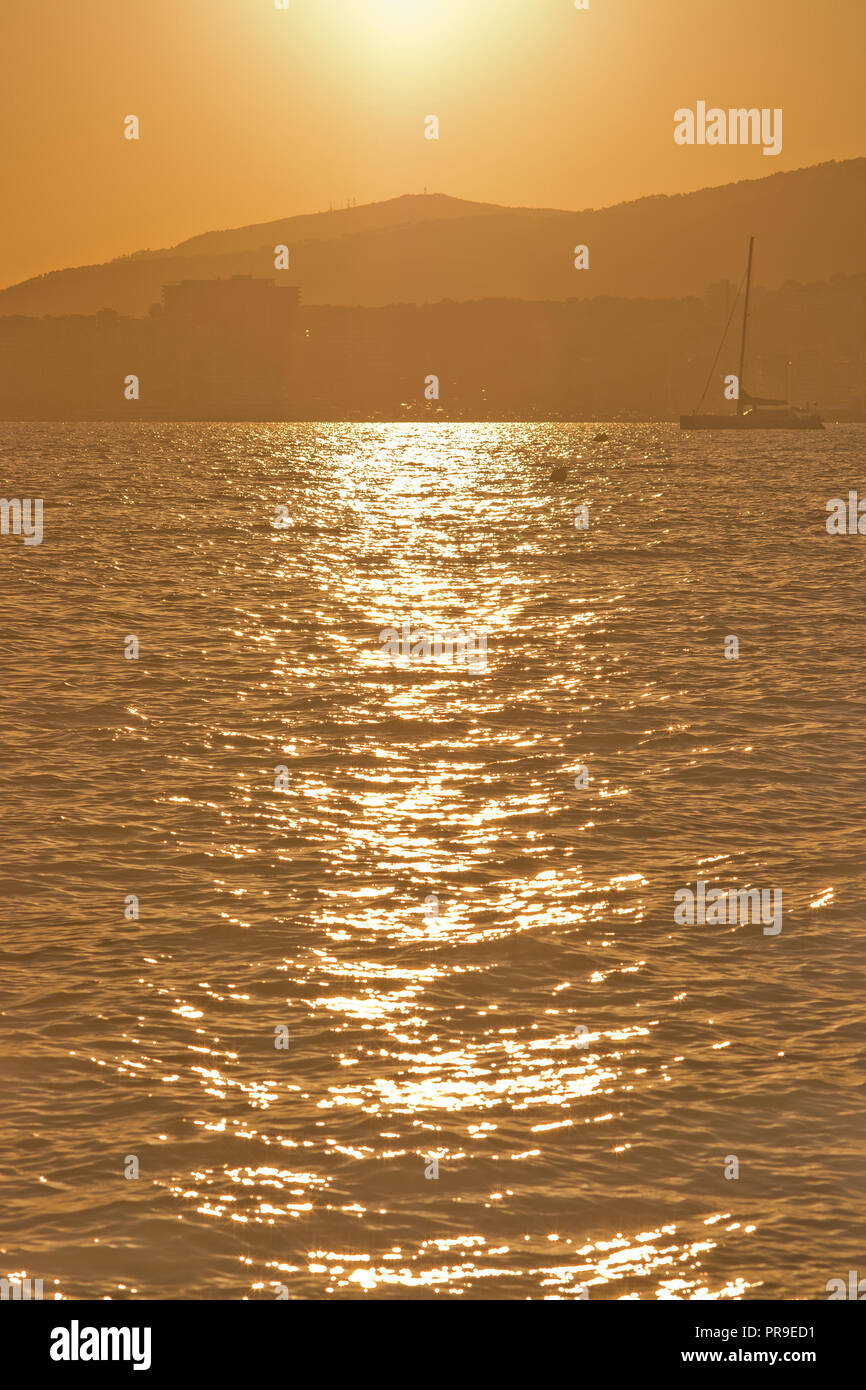 Golden sunshine with stars and sparkles background in the ocean at ...