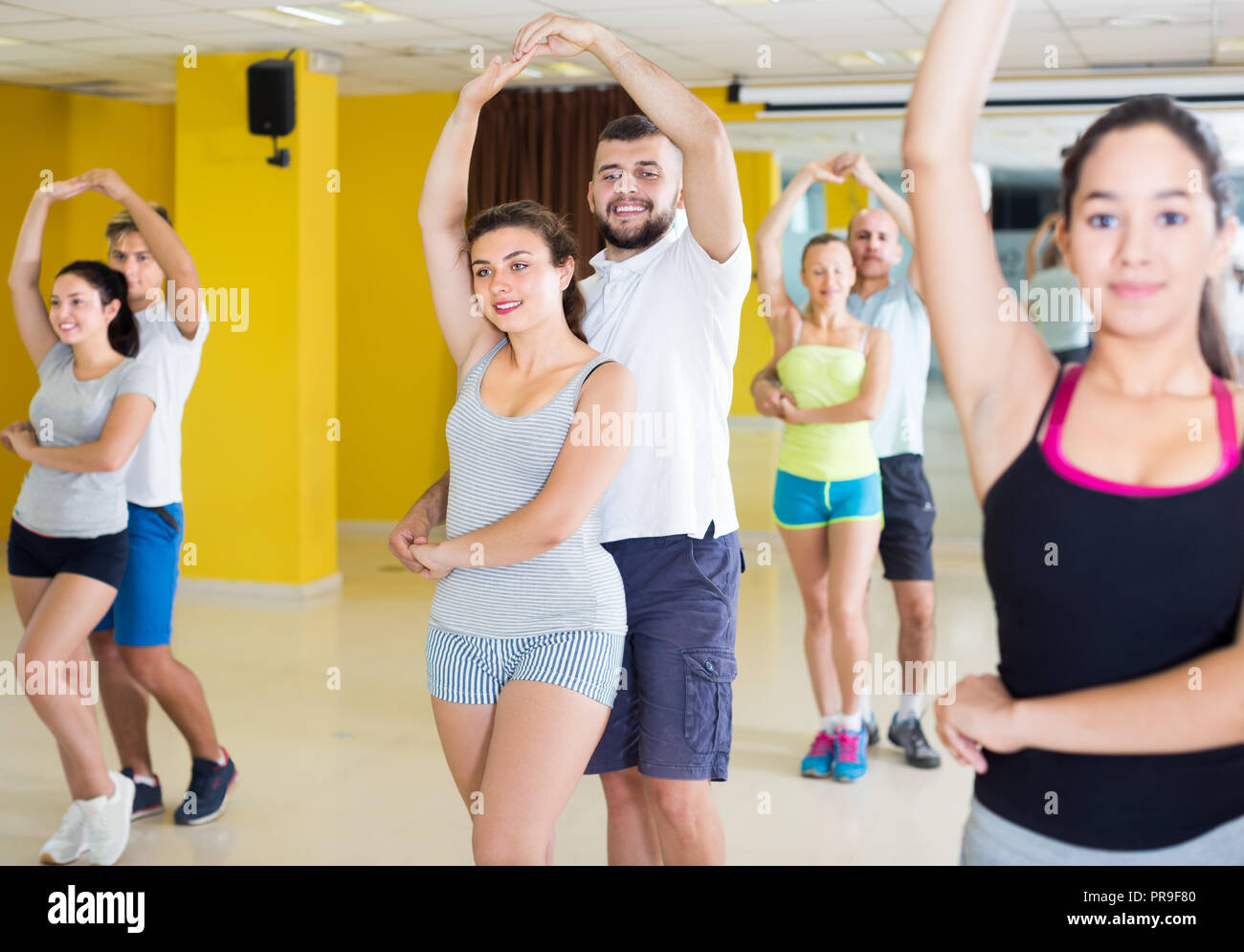 Emotional people dancing salsa in dance hall Stock Photo - Alamy