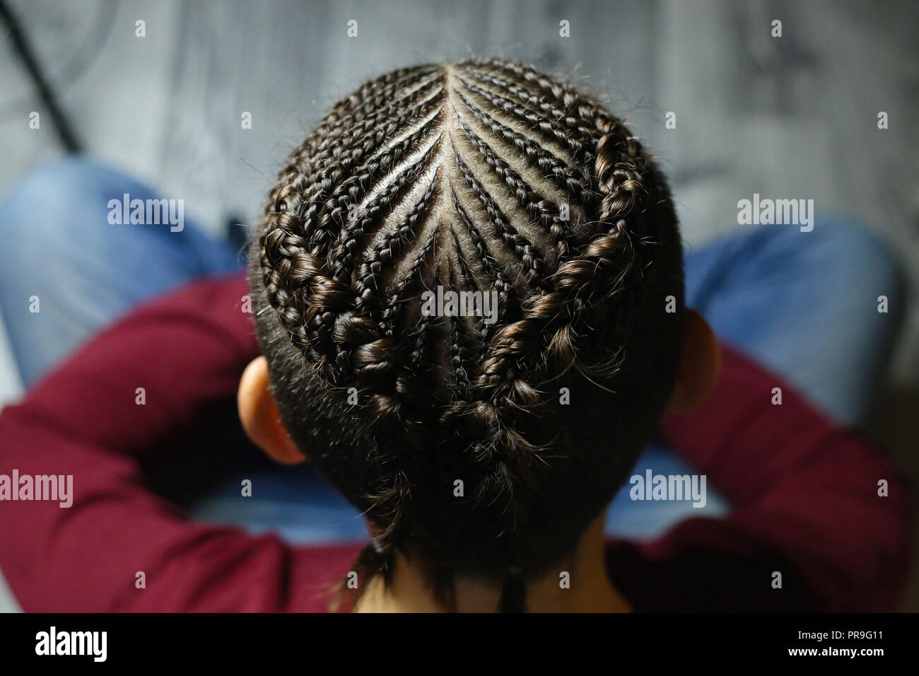 man's hair from thin plaits, creative waves of hair on the head of a ...