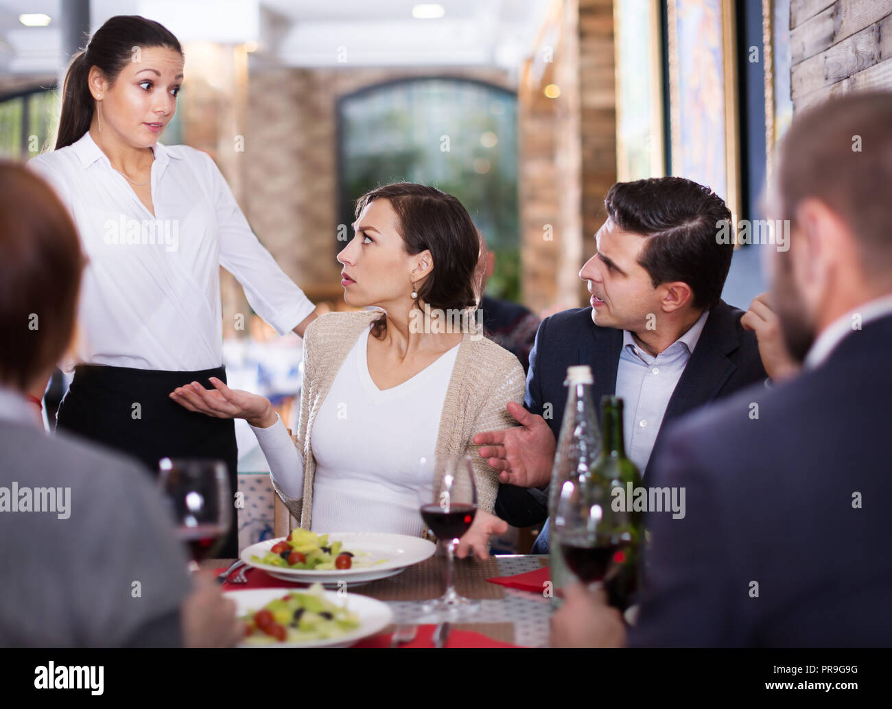 Apologizing to a group of people hi-res stock photography and images ...