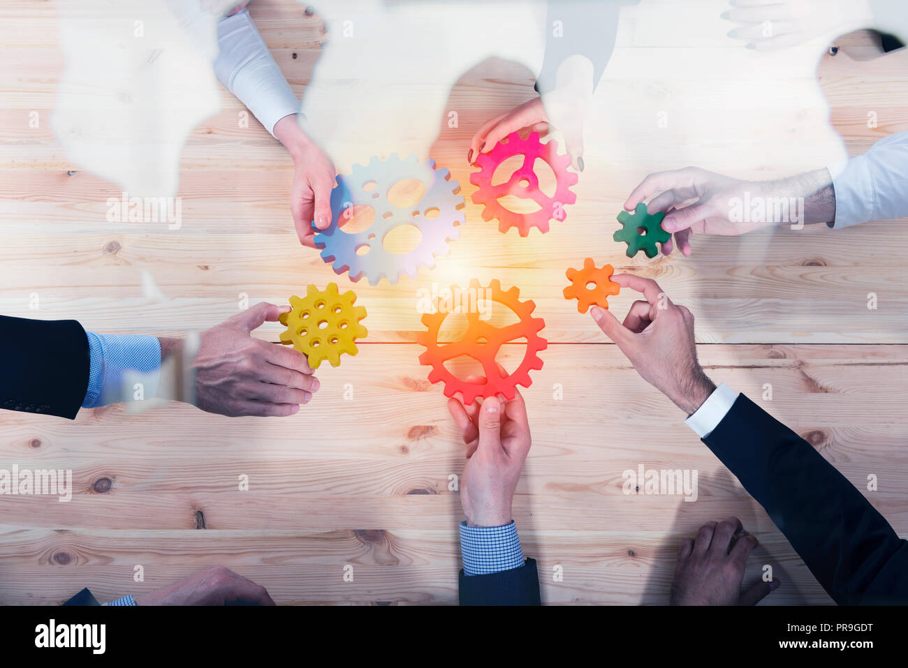 Business team connect pieces of gears. Teamwork, partnership and ...