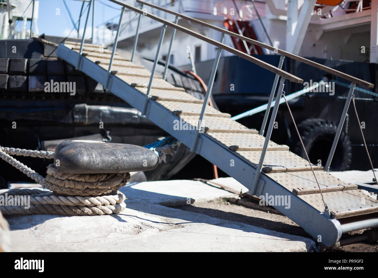 the ship is moored to a dock ladder rope chain Stock Photo - Alamy