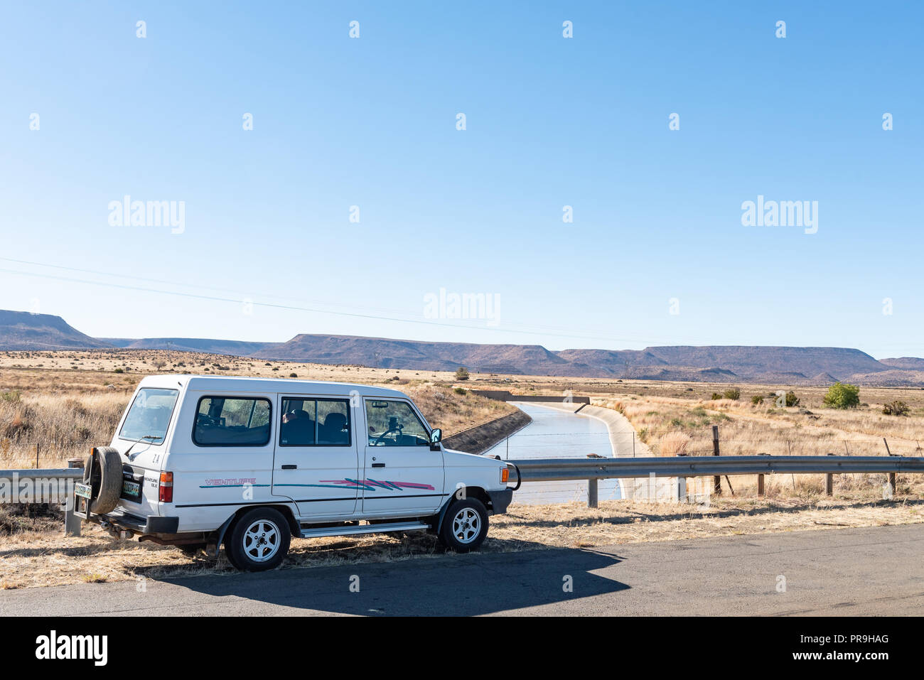 LUCKHOFF, SOUTH AFRICA, AUGUST 6, 2018: An irrigation canal ...
