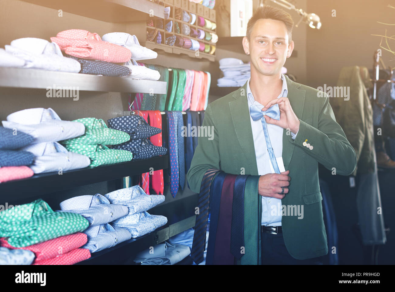 Happy young guy deciding hi-res stock photography and images - Alamy