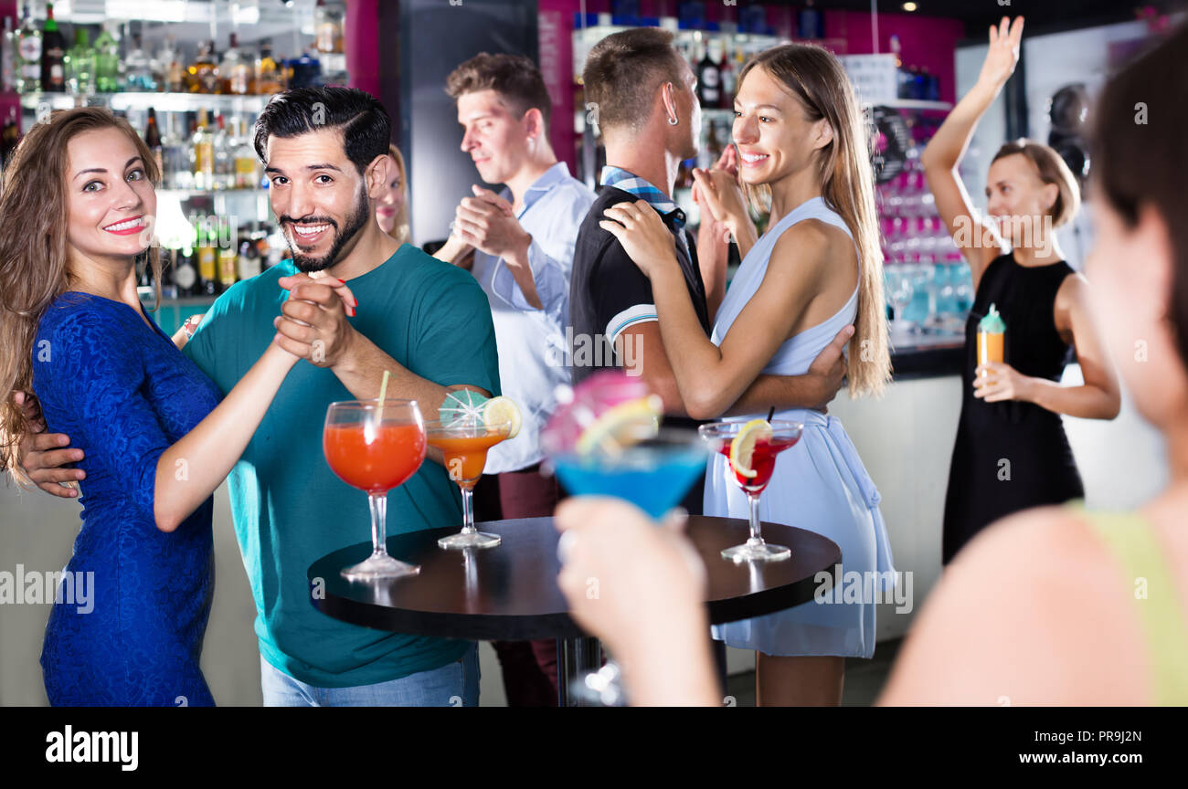 Female with man are dancing in pair on a party at bar Stock Photo - Alamy
