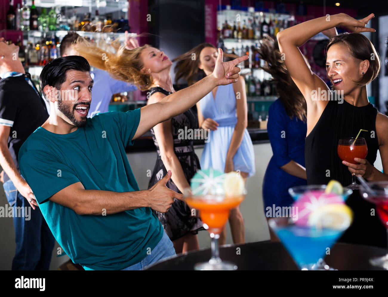 Woman in cocktail dress on bar hi-res stock photography and images - Alamy