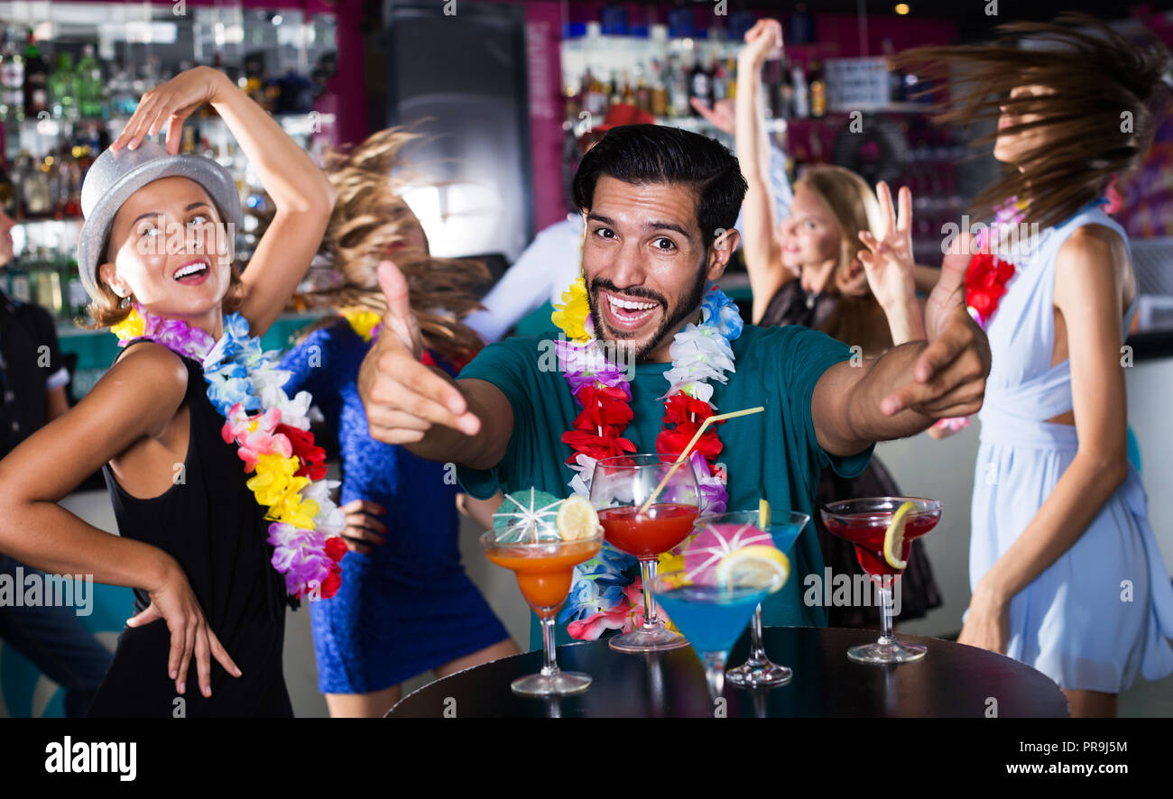 Young happy male is having fun on the hawaiian thematic party Stock ...