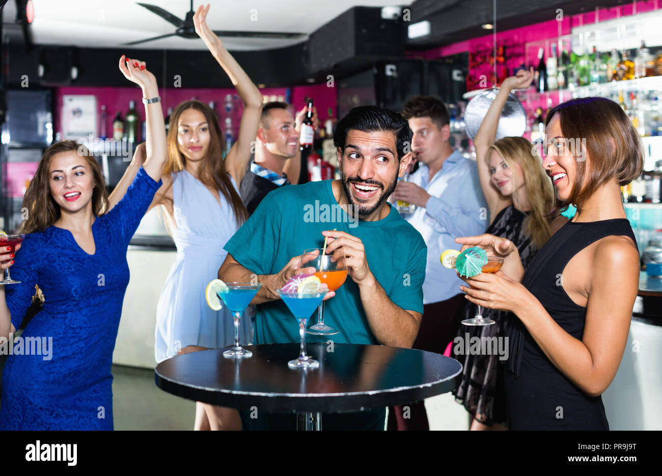 Glad pleasant smiling man with woman are drinking cocktails on ...
