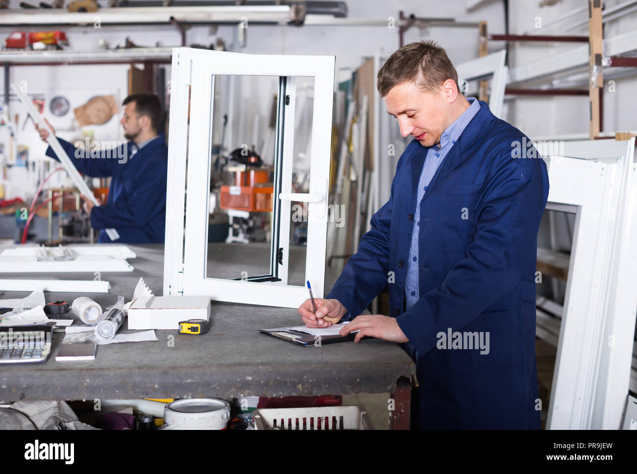 happy european worker doing inspection and checking papers Stock Photo ...