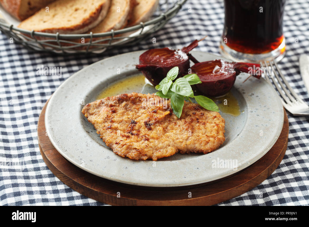 Dutch schnitzel with baked beetroot and beer Stock Photo - Alamy