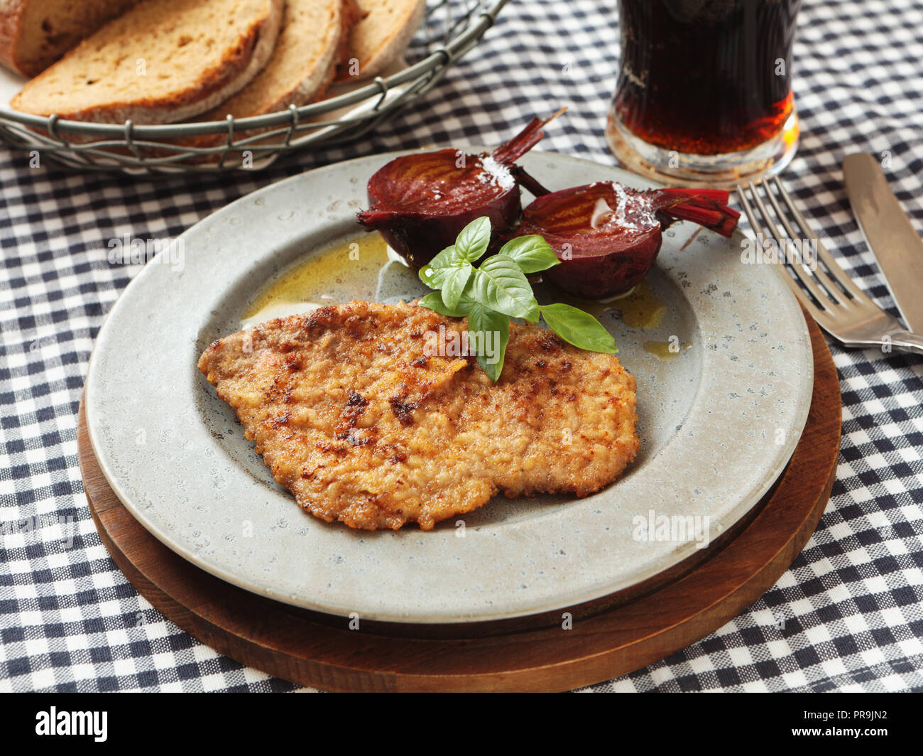 Dutch schnitzel with baked beetroot and beer Stock Photo - Alamy