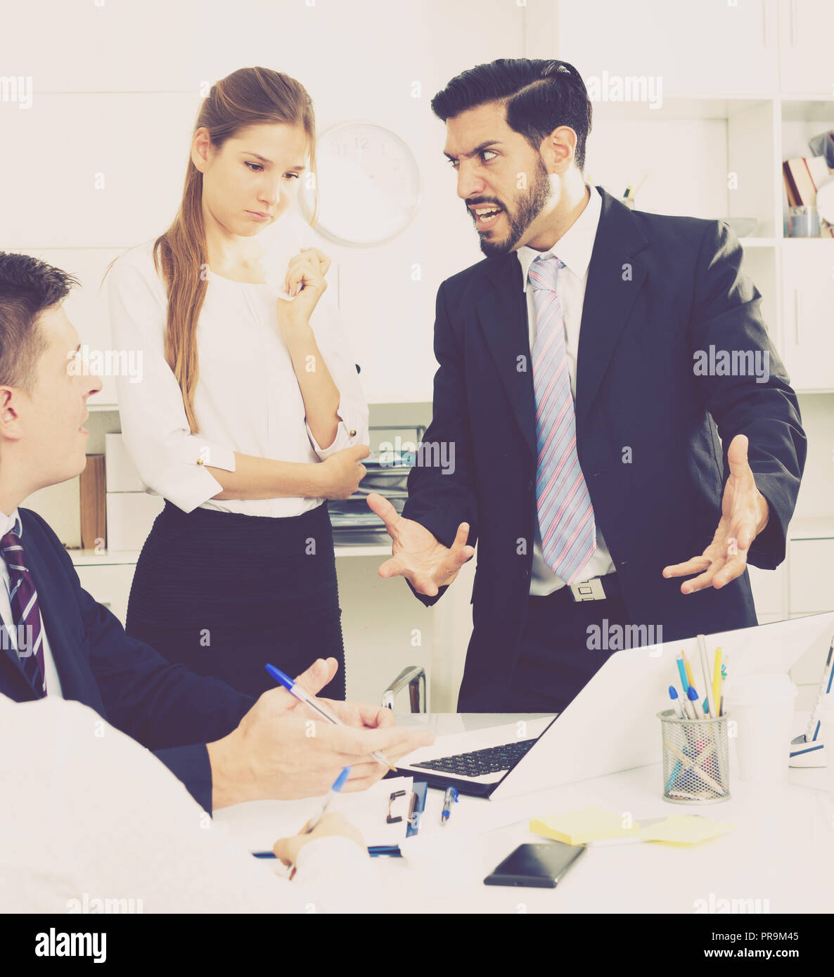 Businessman feeling angry to coworkers in office, pointing out mistakes ...