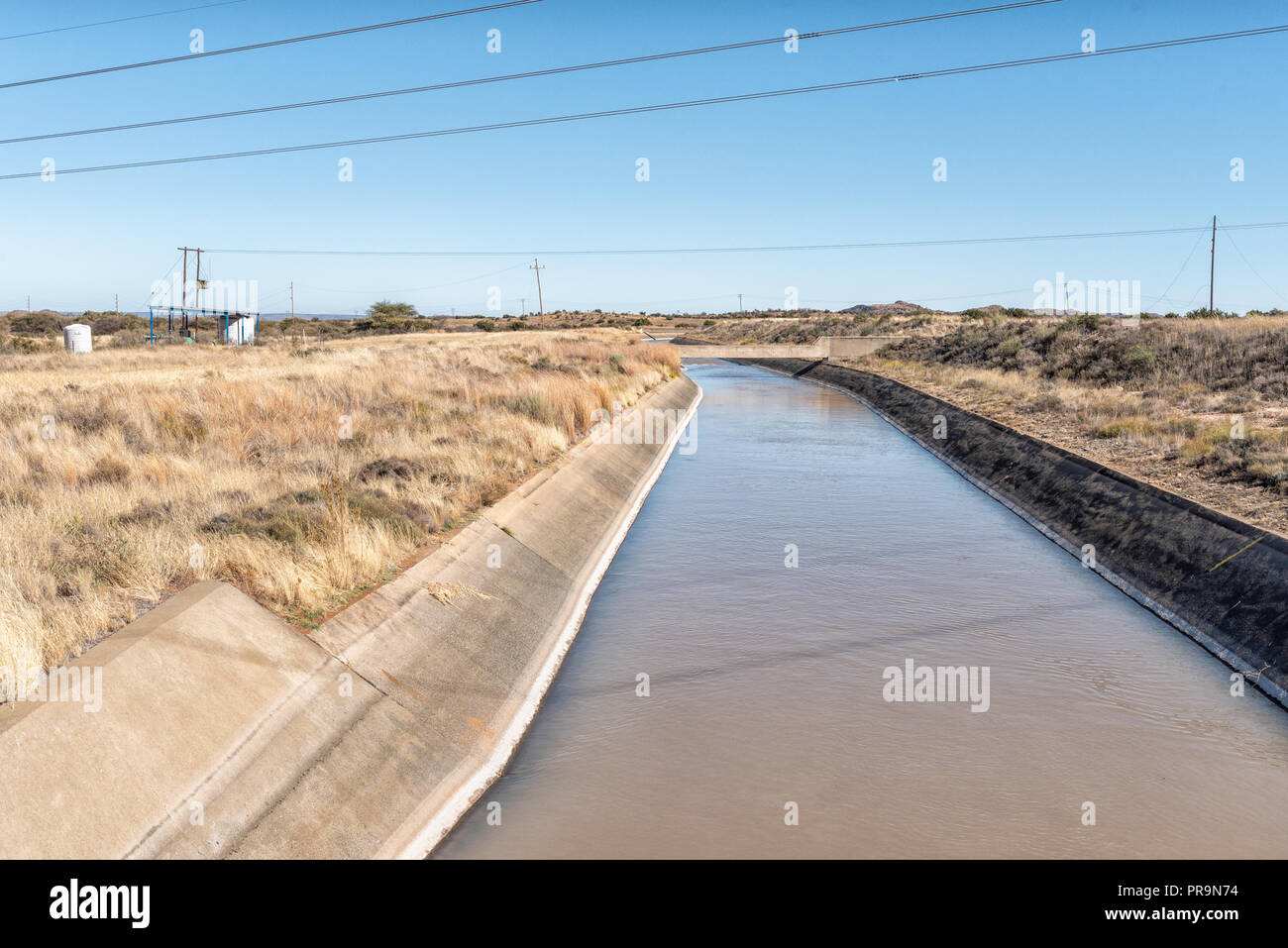 An irrigation canal, originating from the Vanderkloof Dam, near ...