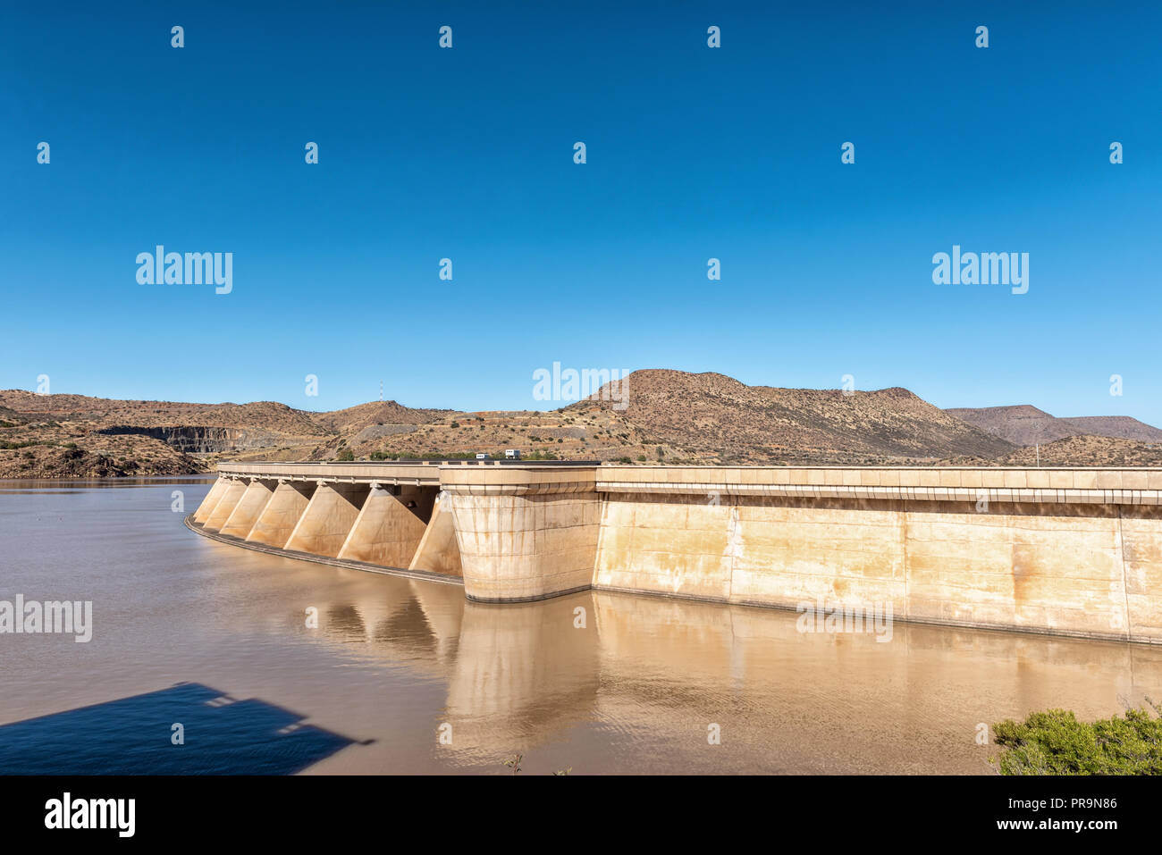 Wall of the Vanderkloof Dam in the Orange River. The road to the ...