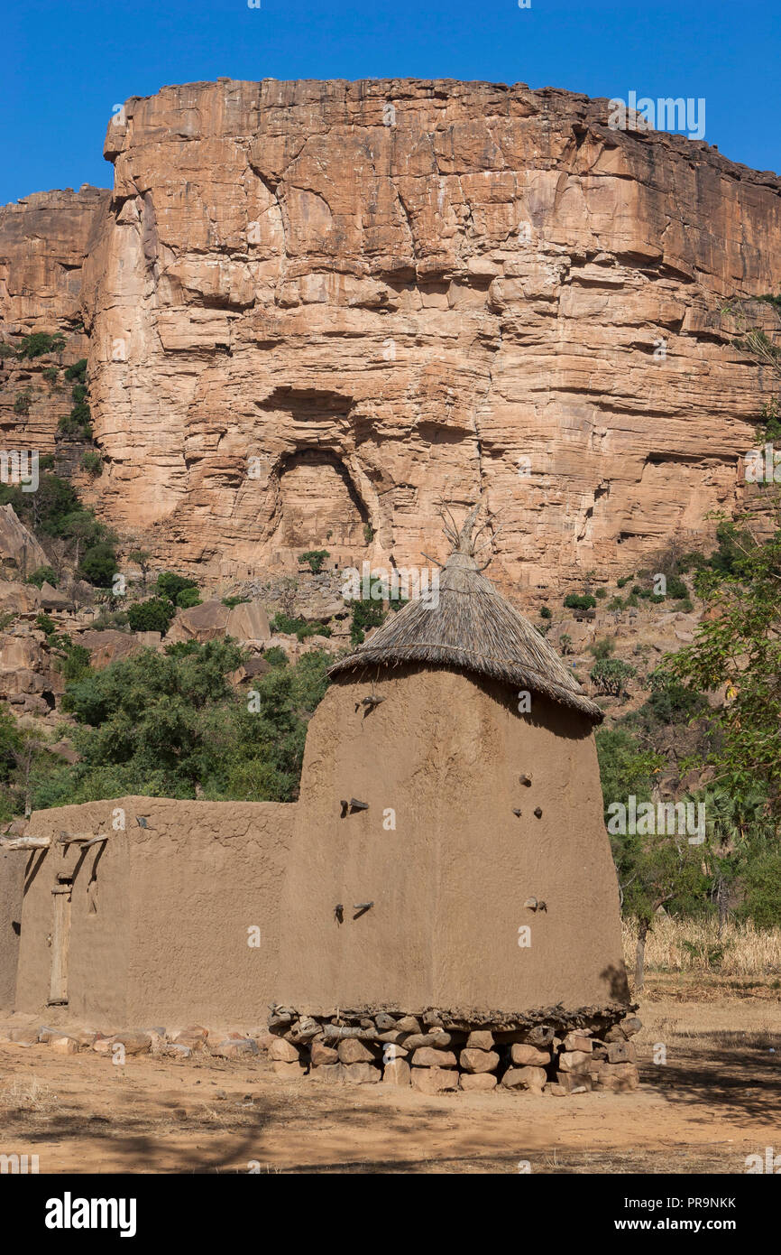 A traditional pointed roof granary in a Dogon village under the ...