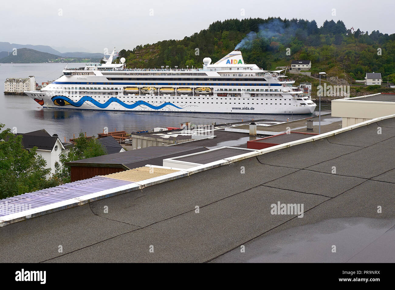 The Giant AIDAvita Cruise Ship, Navigates Through The Narrow Harbour In ...