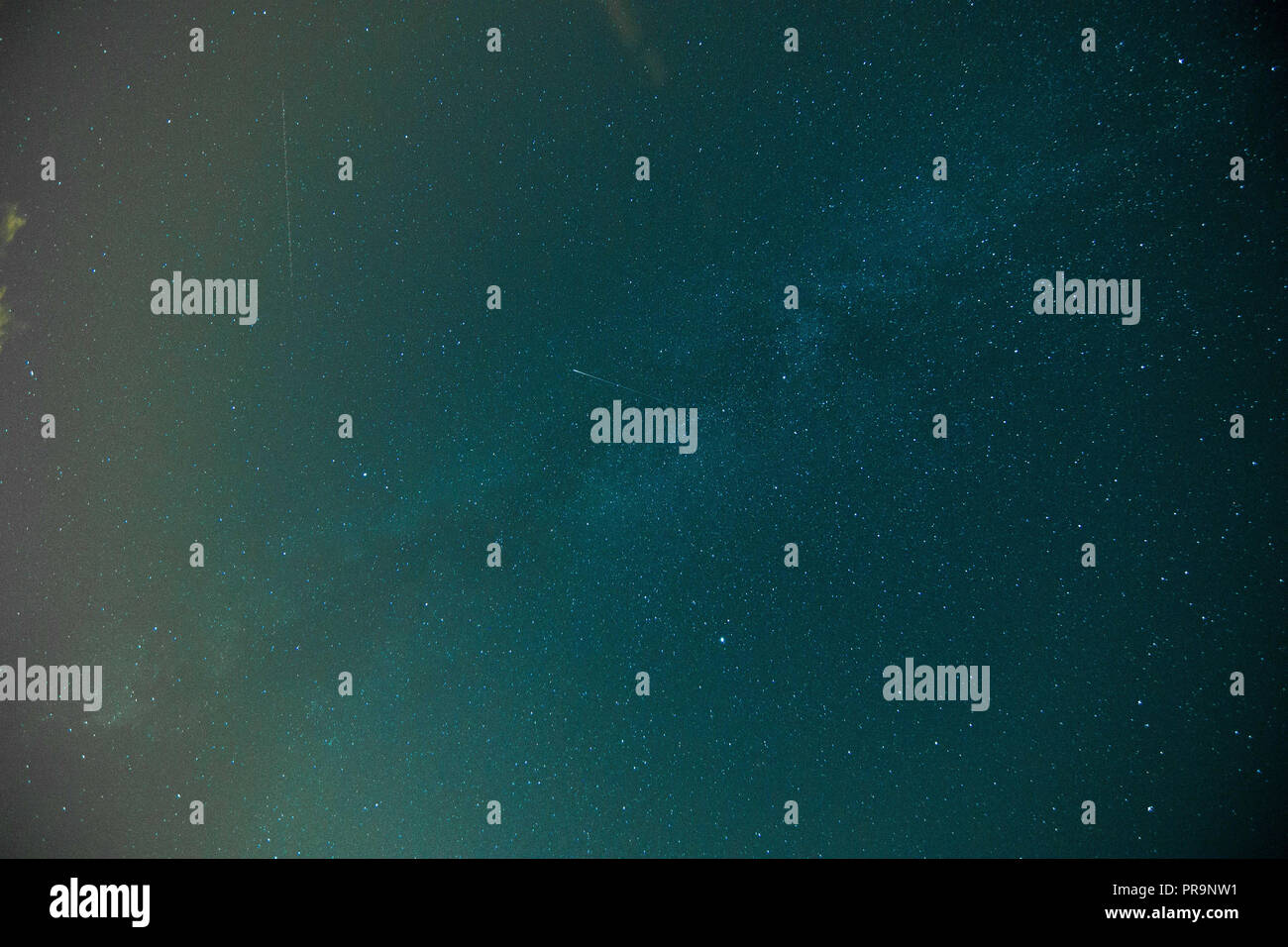 The Milky way visible in night sky Stock Photo - Alamy