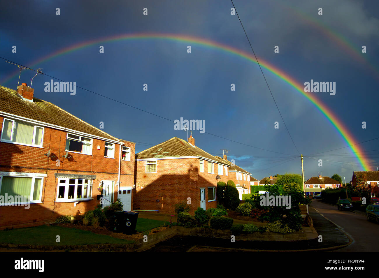 Double Rainbow over houses Stock Photo - Alamy