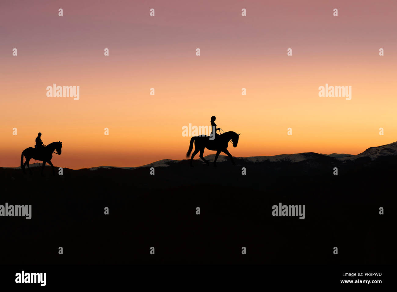 Couple riding horseback sunset hi-res stock photography and images - Alamy