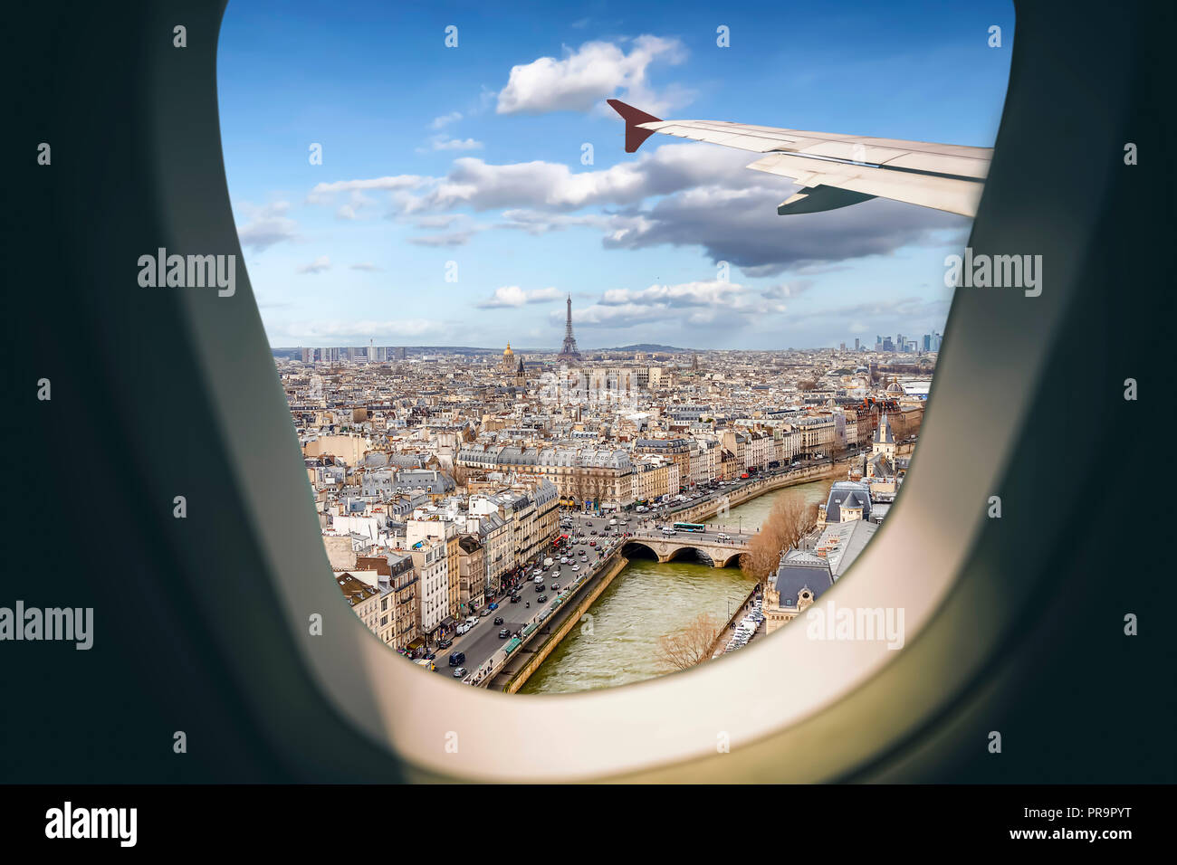 Aerial view Paris cityscape through airplane window while approaching ...