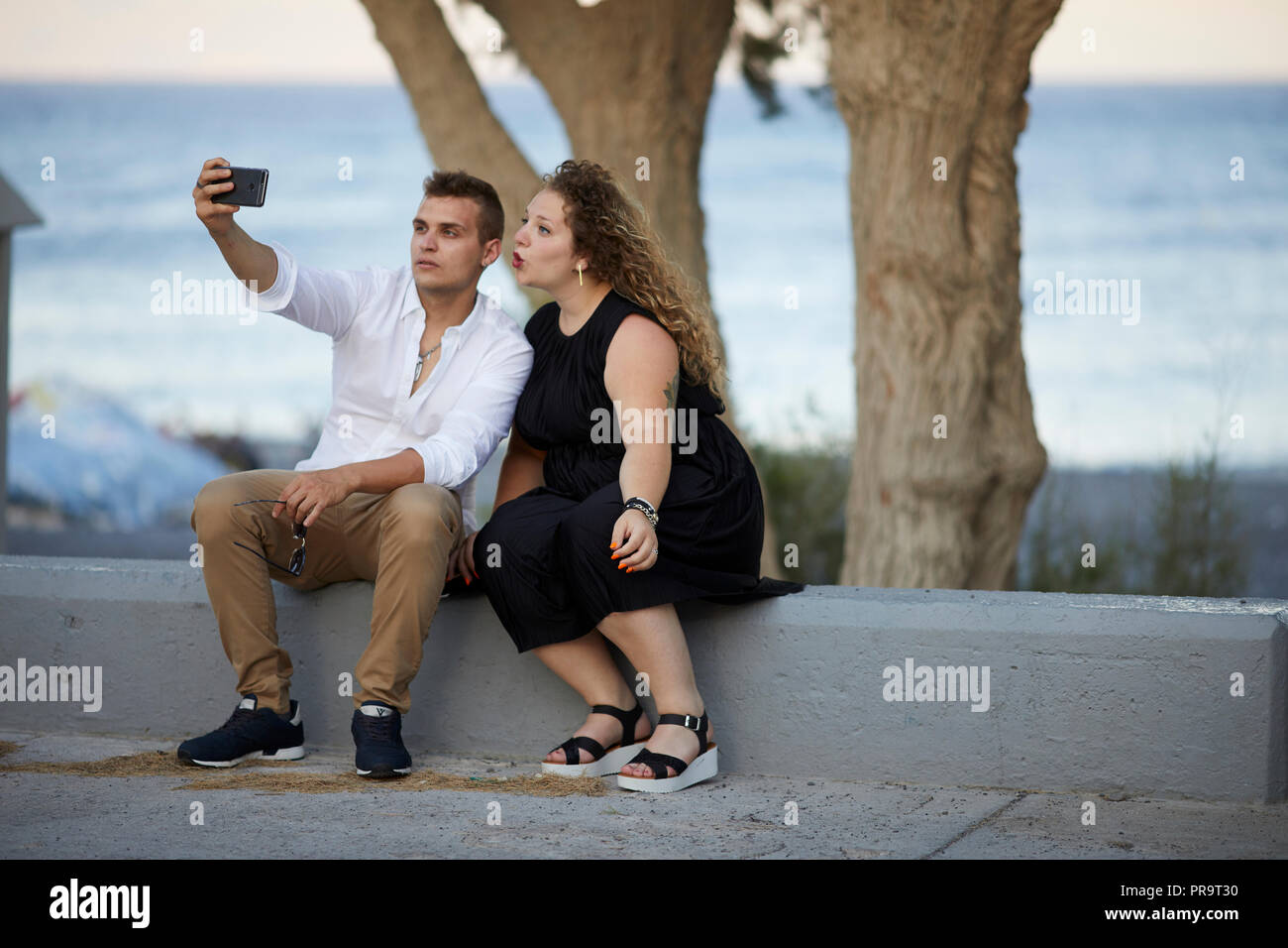Couple take a selfie photograph in the greek island of ,Santorini, a ...