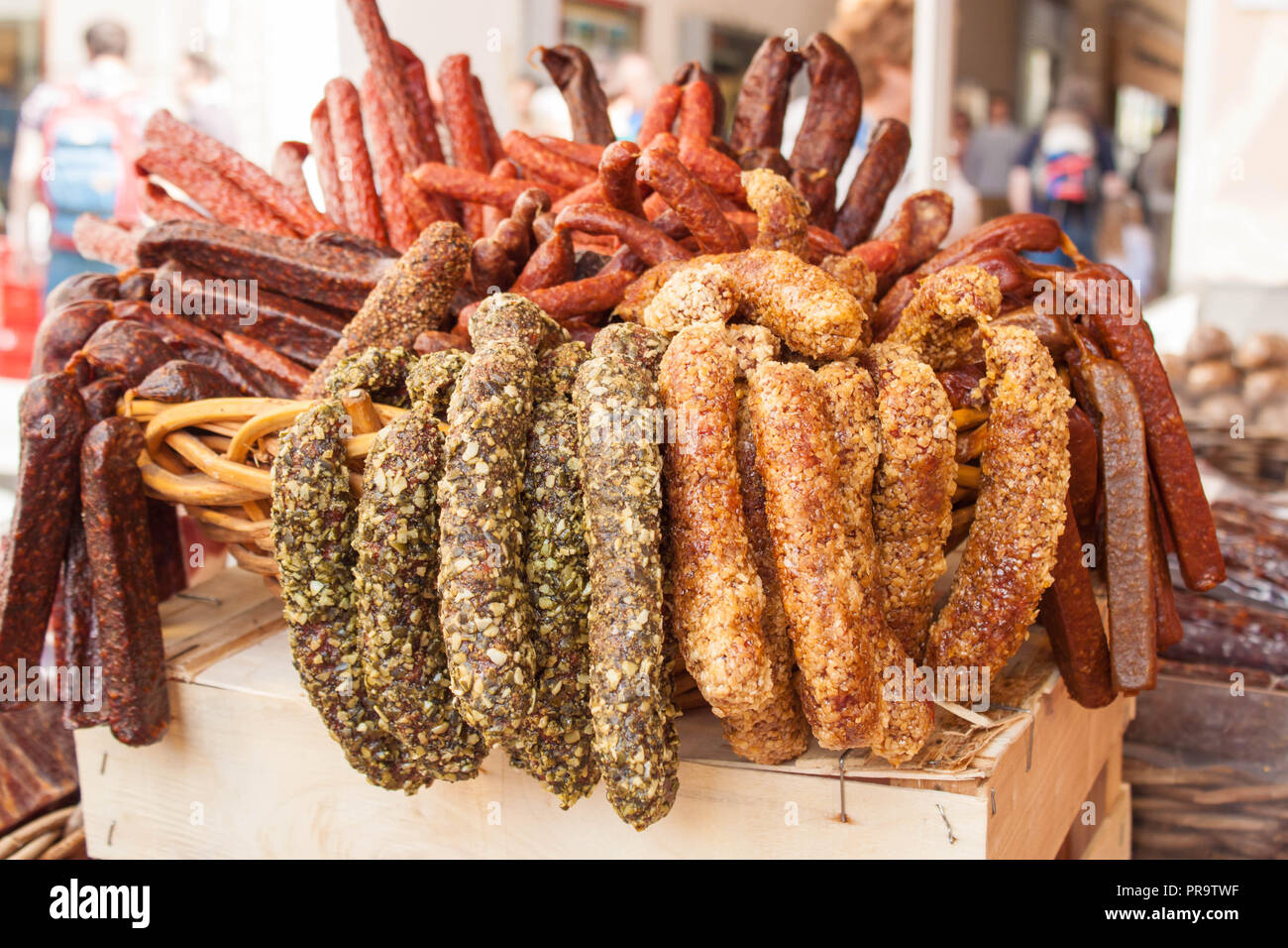 Different kinds of smoked sausages and salamies for sale on a stall of ...