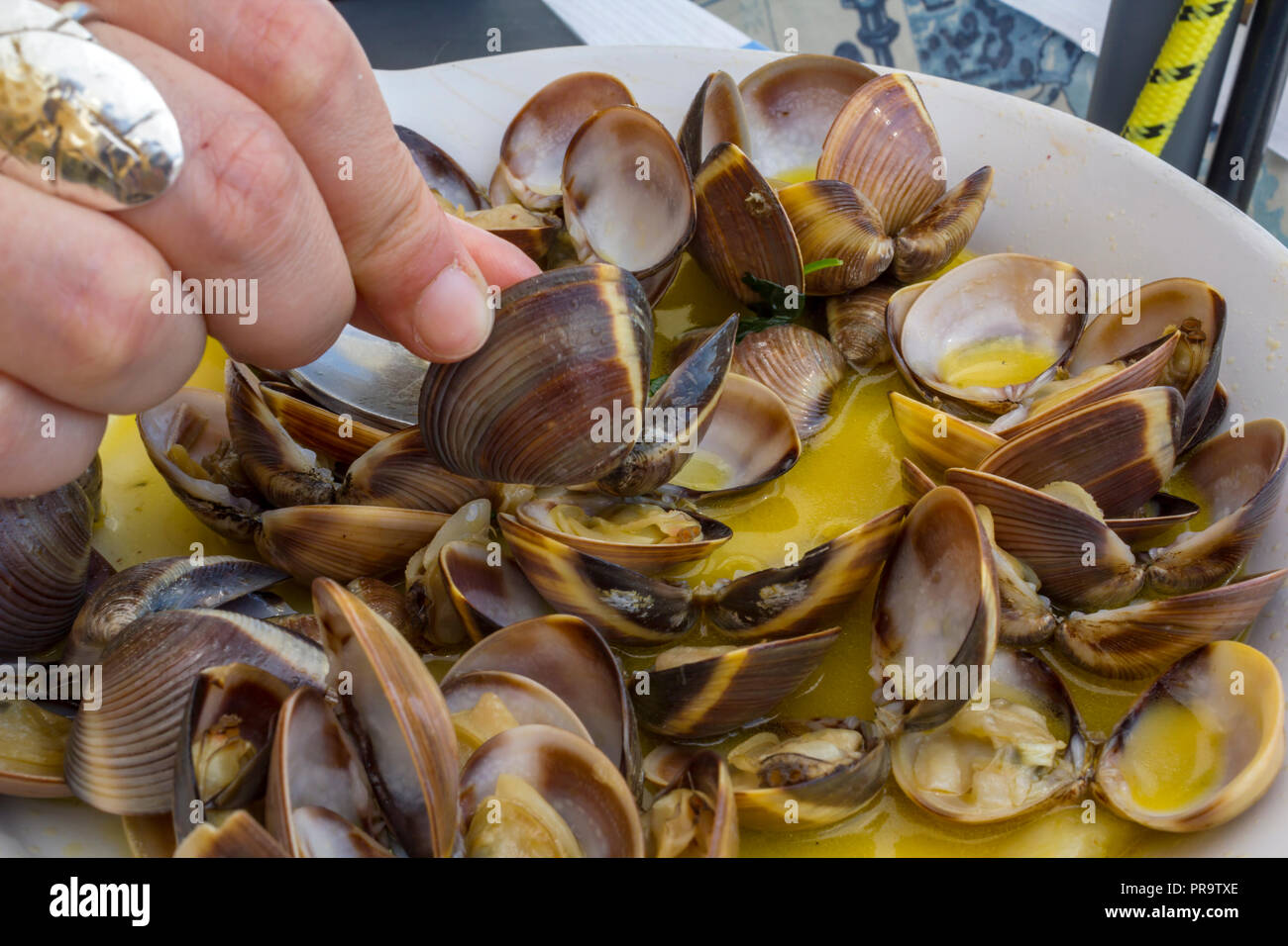 Woman eating seafood Stock Photo - Alamy