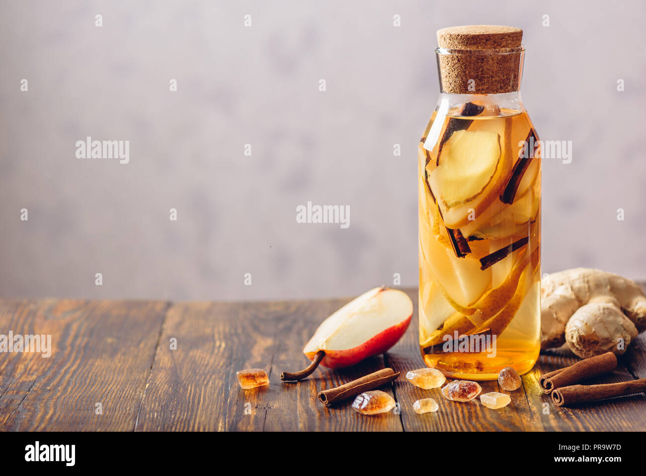 Bottle of Beverage with Sliced Pear, Cinnamon Stick, Ginger Root and ...